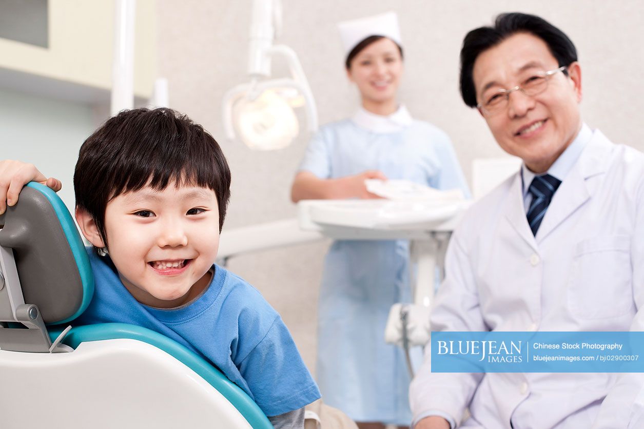 Little Chinese patient receiving treatment in dental clinic-High-res stock photo for download
