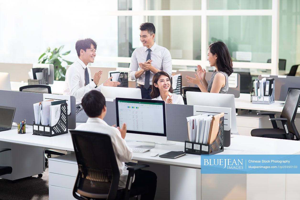 Chinese business people clapping in office-High-res stock photo for ...