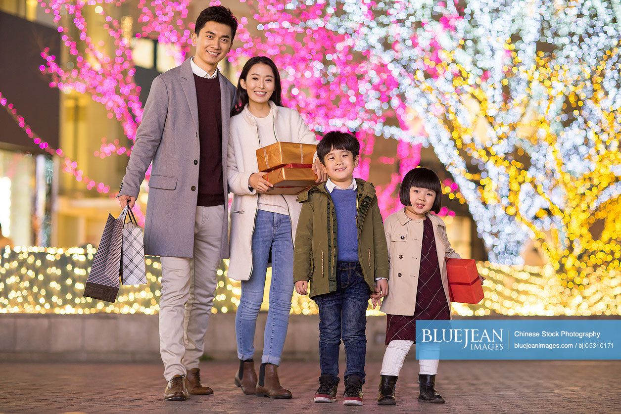 Cheerful young family shopping for Chinese new year-High-res stock ...