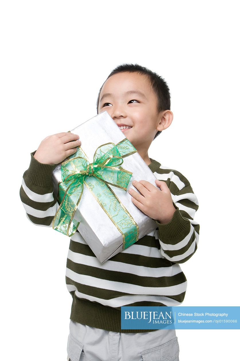 Little Chinese boy holding gift box-High-res stock photo for download