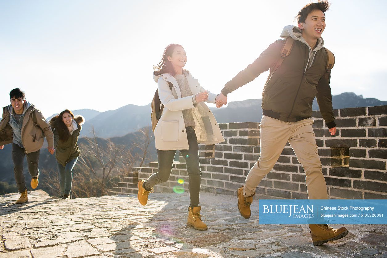 Happy young Chinese friends enjoying winter outing on the Great Wall-High-res stock photo for ...