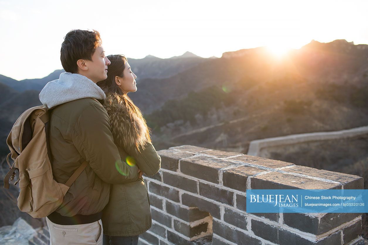 Happy young Chinese couple enjoying winter outing on the Great Wall-High-res stock photo for ...