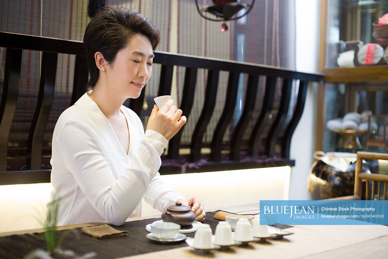 Mid adult Chinese woman performing tea ceremony-High-res stock photo ...