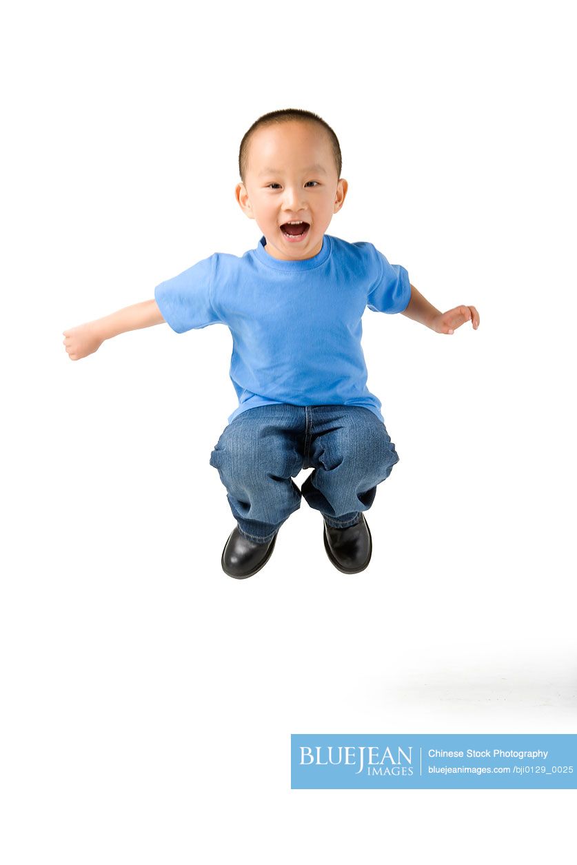 young Chinese boy jumps in the air-High-res stock photo for download