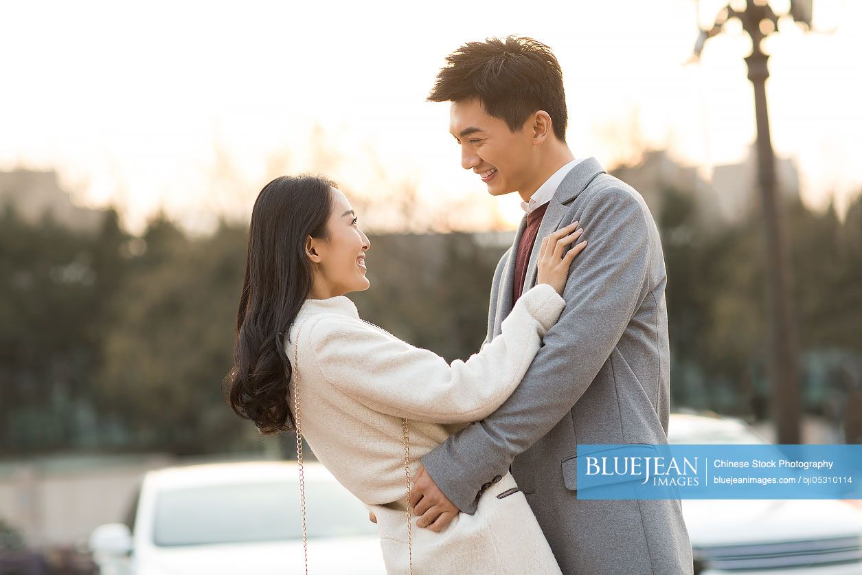Cheerful young Chinese couple dating-High-res stock photo for download