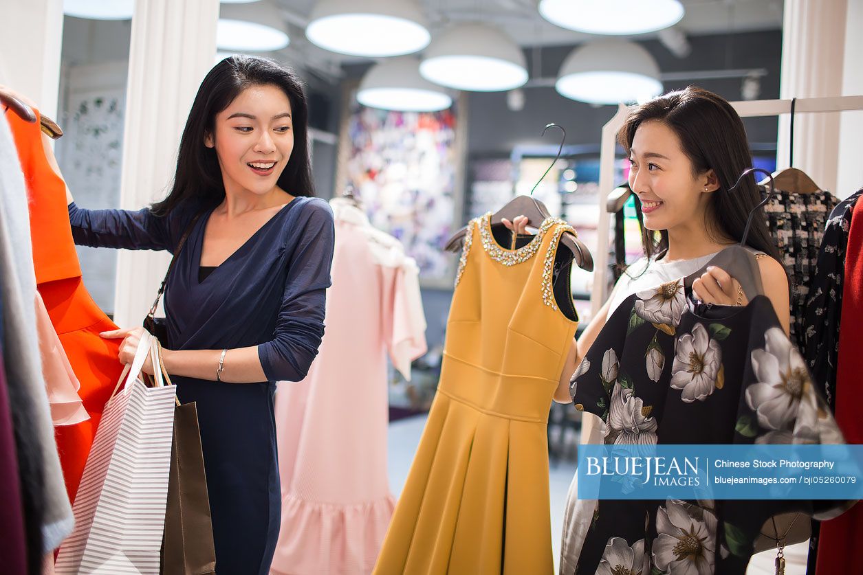 Best Chinese female friends shopping in clothing store-High-res stock ...