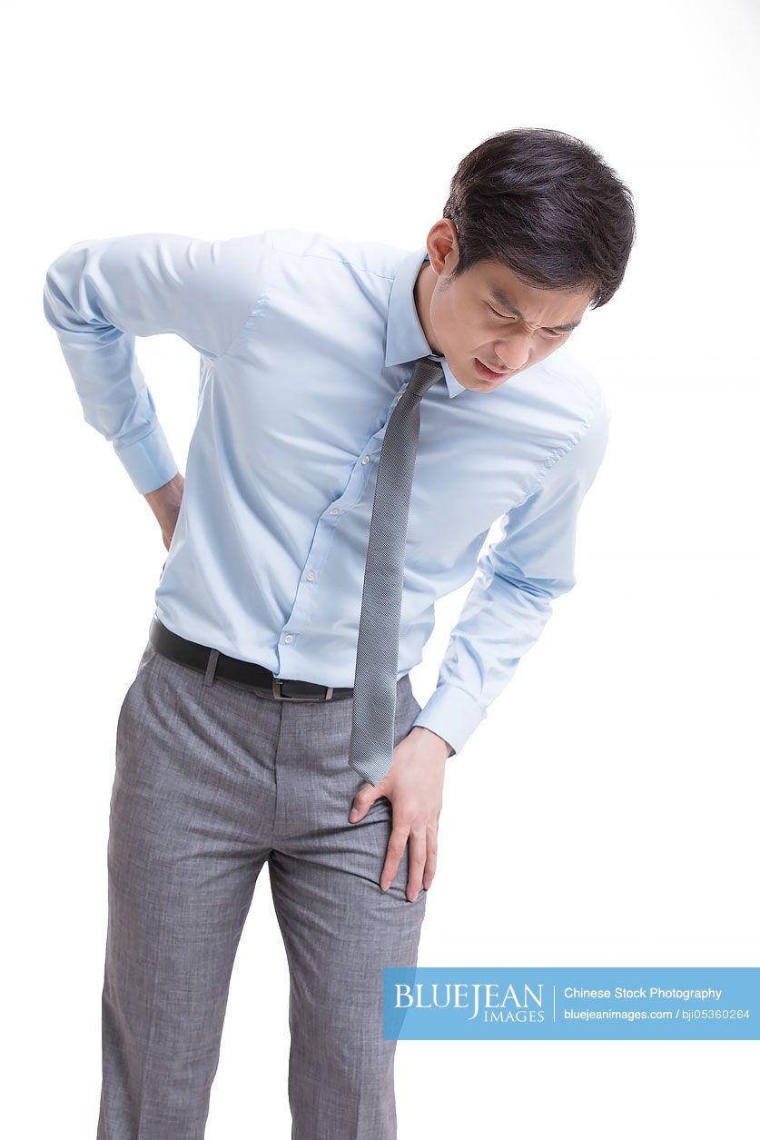 Young Chinese businessman suffering from backache-High-res stock photo ...