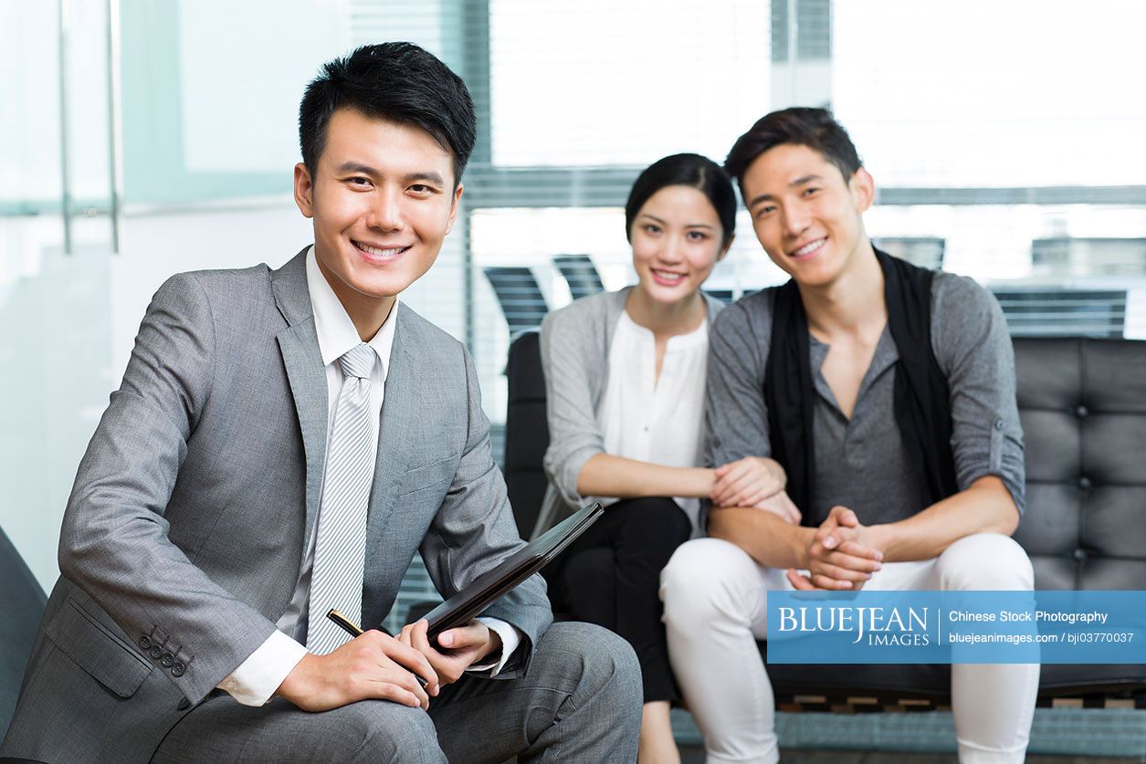 Young Chinese couple with financial consultant-High-res stock photo for ...