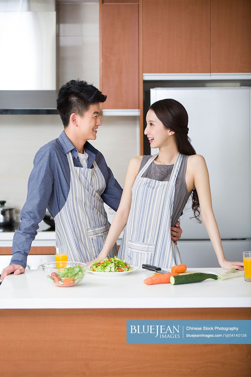 Young Chinese couple cooking in the kitchen-High-res stock photo for ...