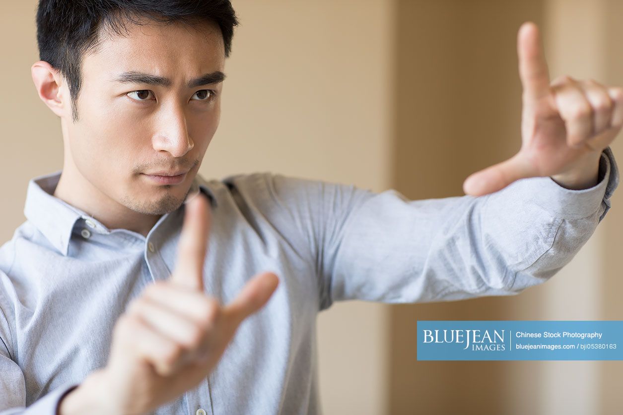 Young Chinese man designing home renovation-High-res stock photo for download