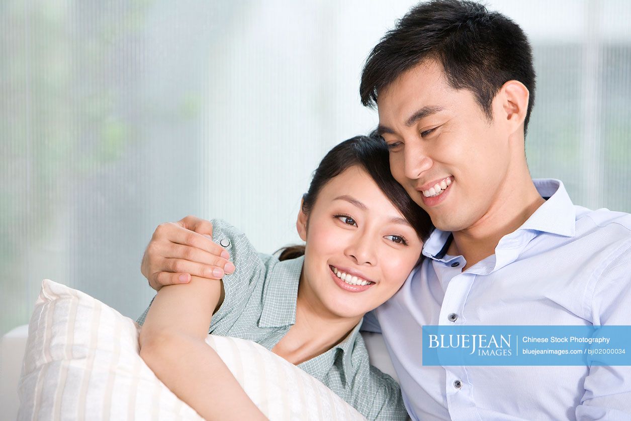 Portrait of Chinese couple relaxing on the couch-High-res stock photo ...