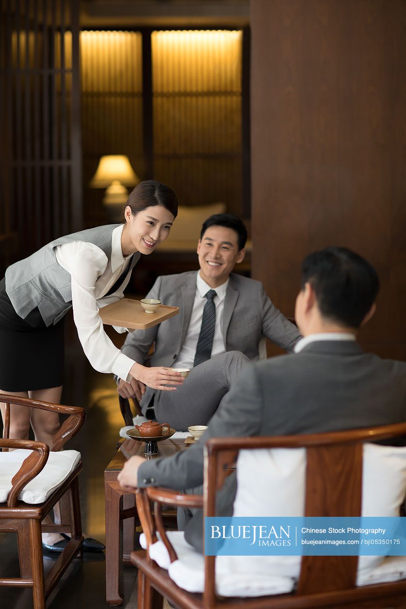Cheerful Chinese businessmen talking in tea room-High-res stock photo ...