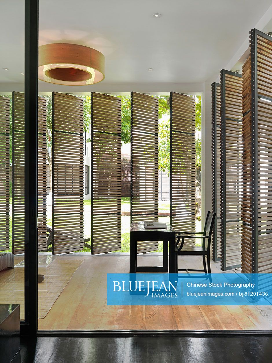 Chair and table with louvered shutters at The Library; Hat Chaweng-High ...
