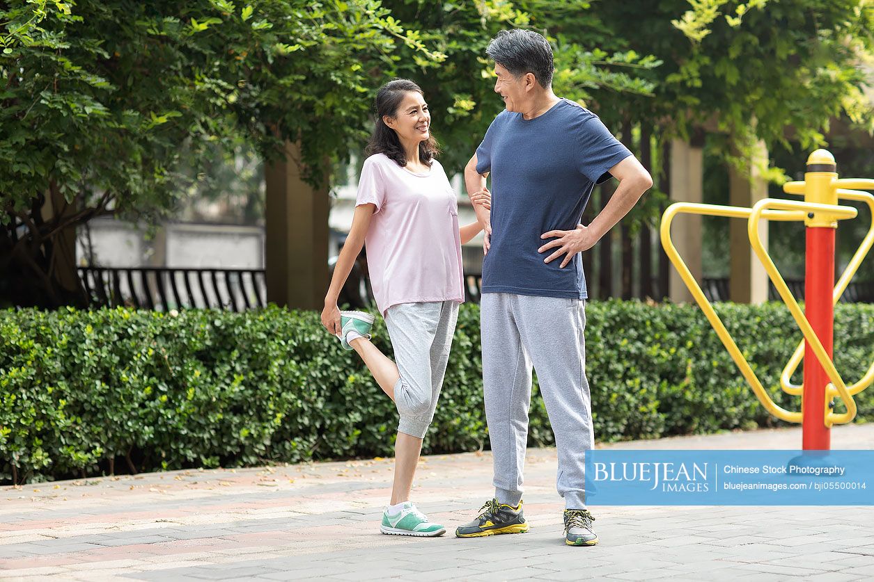 Happy mature Chinese couple exercising in park-High-res stock photo for download