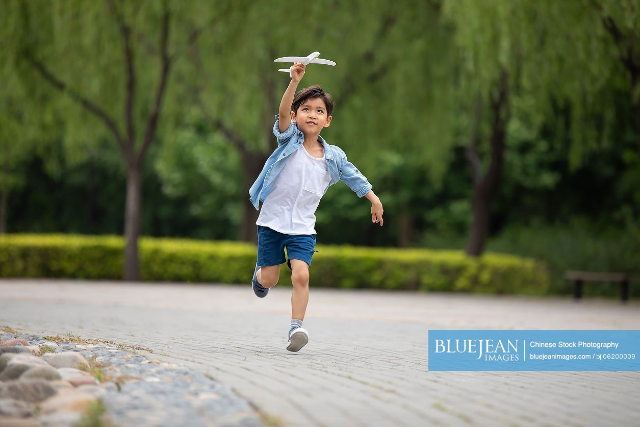 Little Chinese boy playing in park-High-res stock photo for download