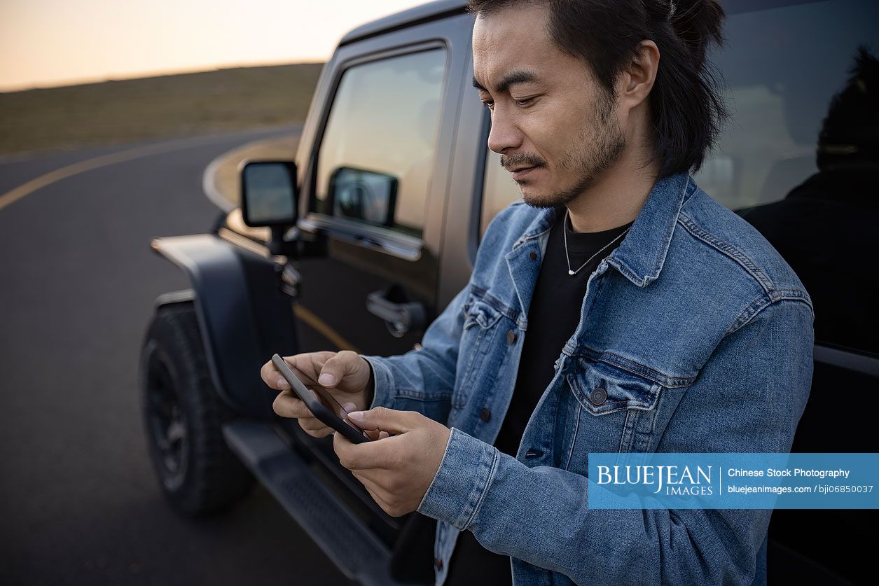 Happy Chinese mid adult man using smart phone-High-res stock photo for ...
