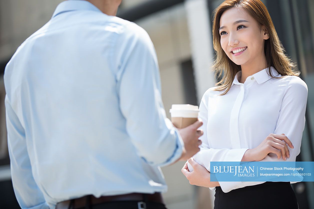 Young Chinese business people chatting outdoors-High-res stock photo ...