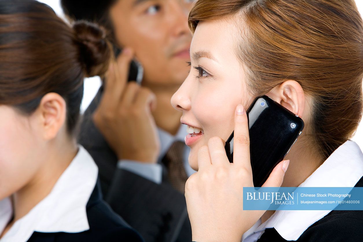 Busy Chinese commuters on the phone-High-res stock photo for download