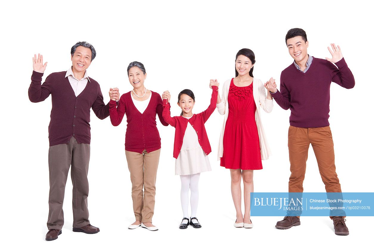 Cheerful Chinese family holding hands-High-res stock photo for download