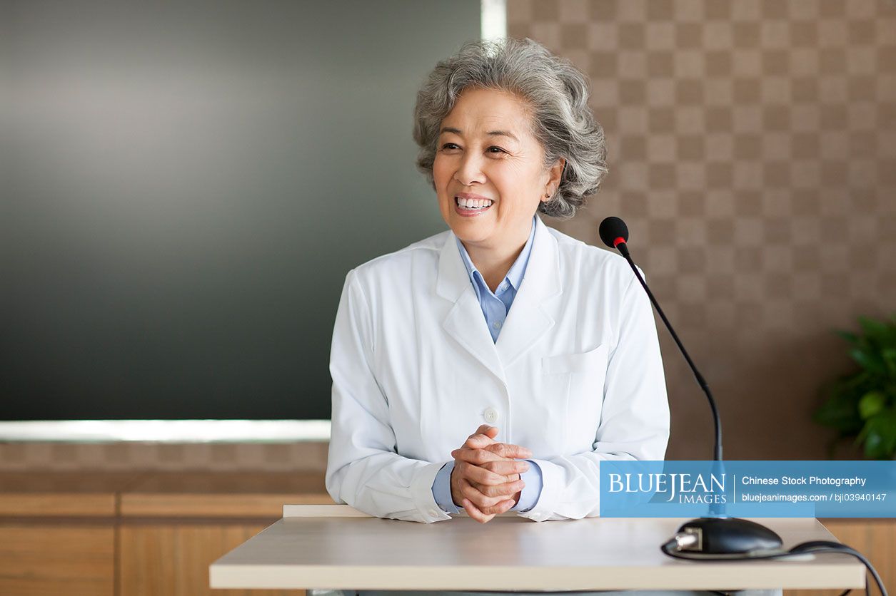 Senior female Chinese doctor giving a speech-High-res stock photo for ...