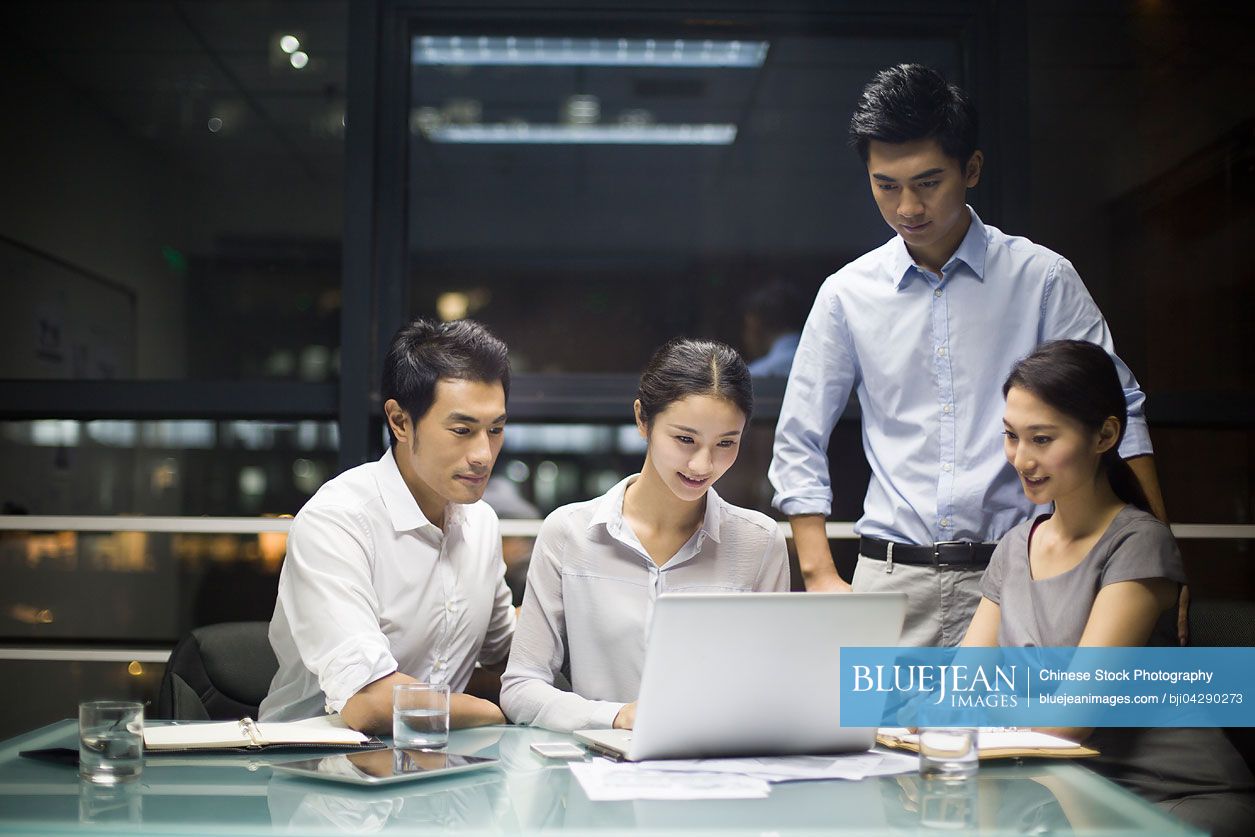 Young Chinese business people talking in meeting-High-res stock photo for download