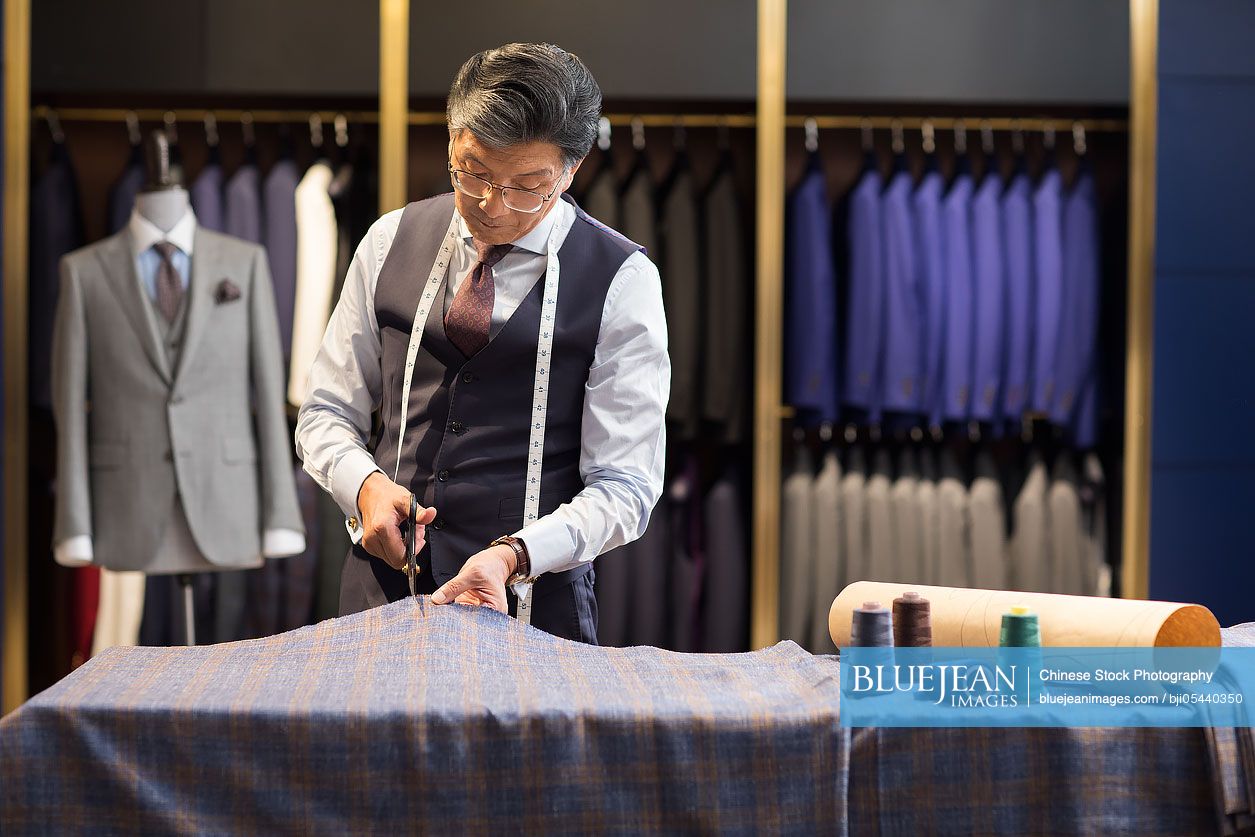 Confident Chinese fashion designer working-High-res stock photo for ...