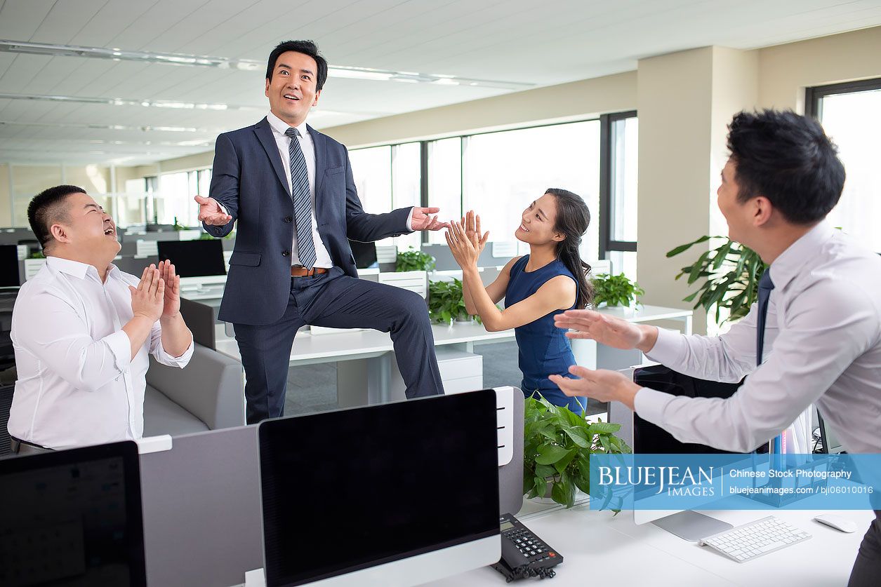 Chinese business people clapping hands in office-High-res stock photo ...