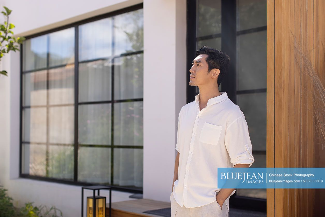 Happy mid adult Chinese man on vacation-High-res stock photo for download