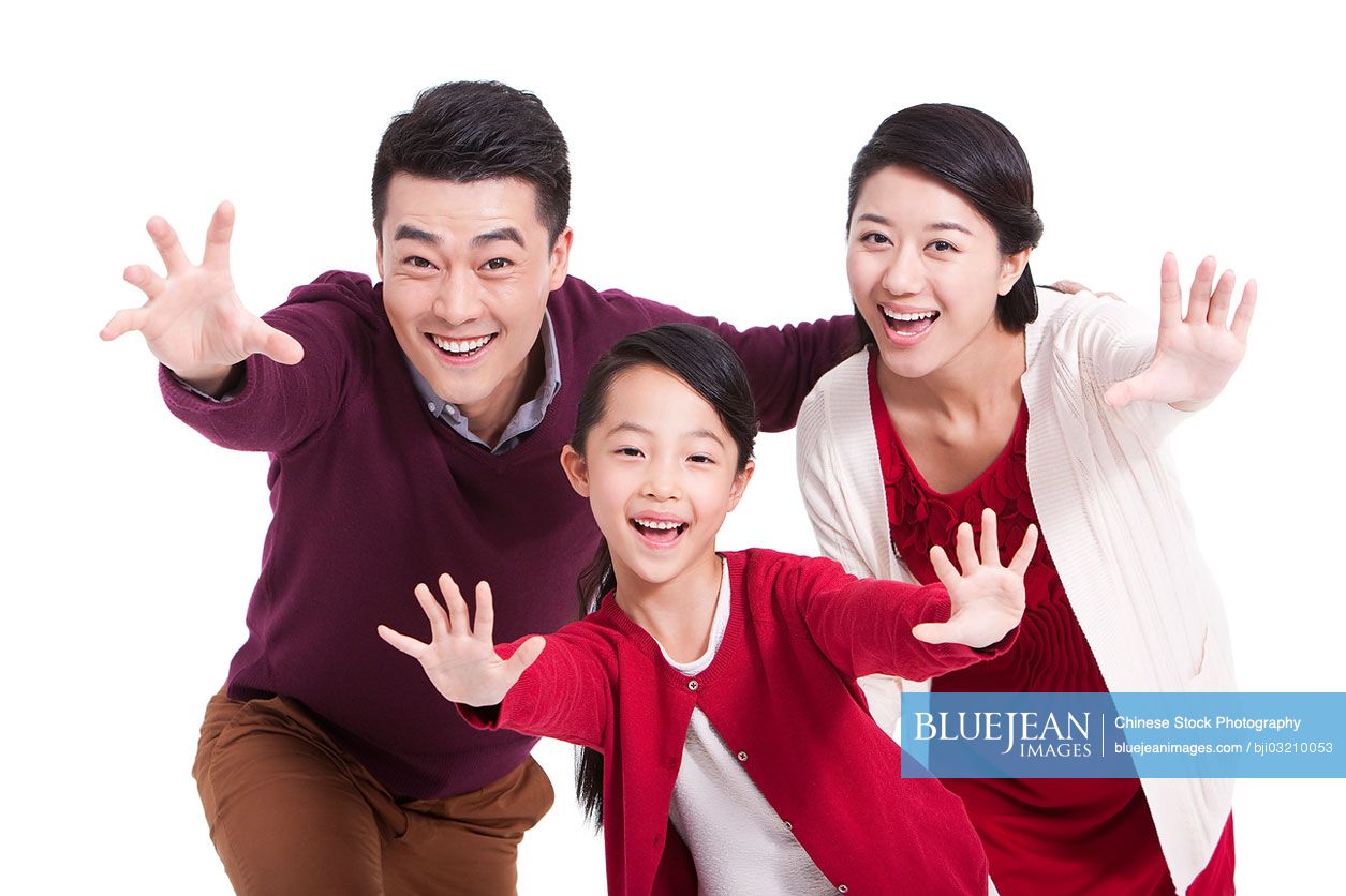 Happy Chinese family waving-High-res stock photo for download
