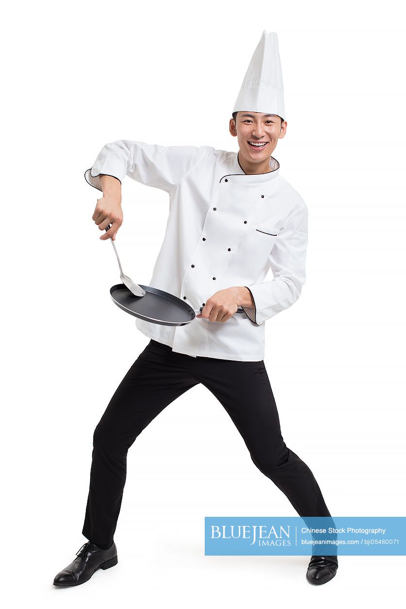 Cheerful Chinese chef cooking-High-res stock photo for download