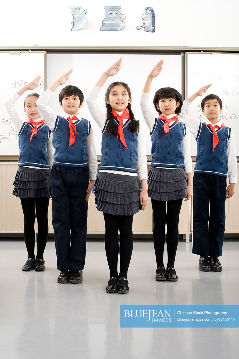 Young Chinese students saluting in a row at school-High-res stock photo ...
