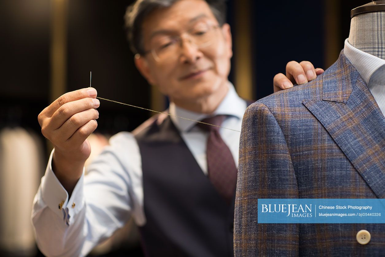 Confident Chinese fashion designer working-High-res stock photo for ...