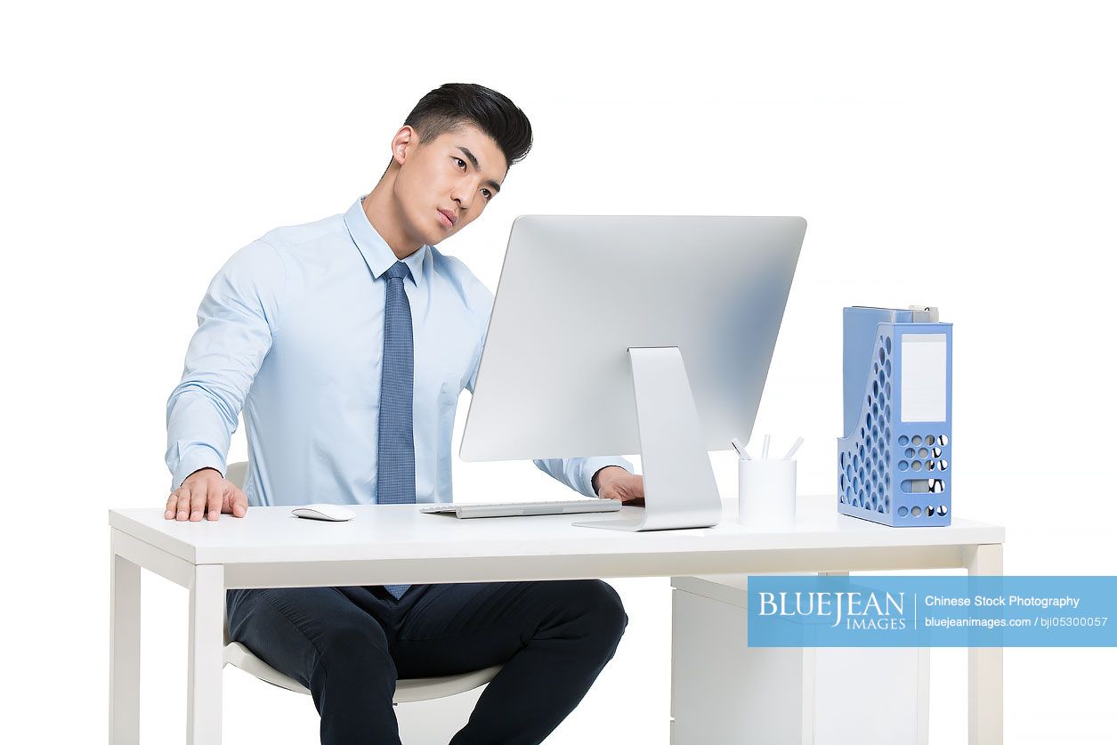 Tired young Chinese businessman working in office-High-res stock photo ...