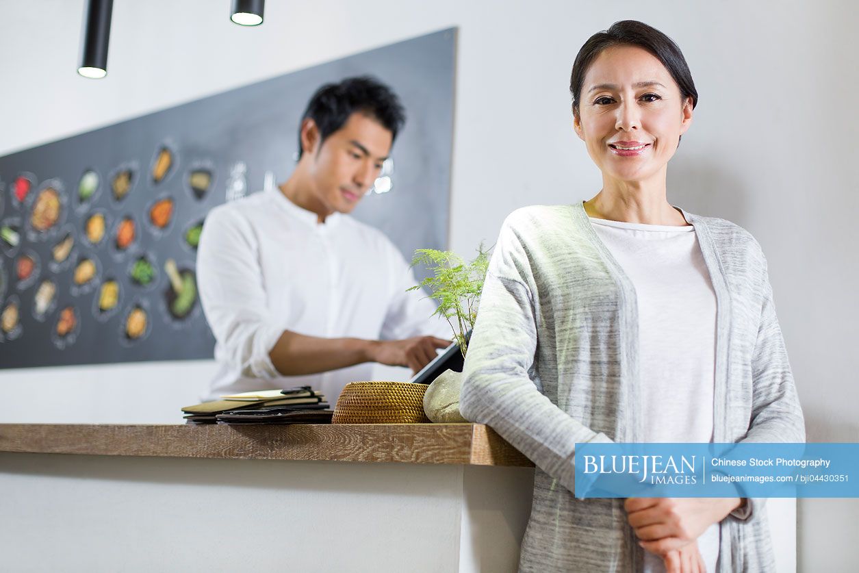 Chinese restaurant owner and cashier-High-res stock photo for download
